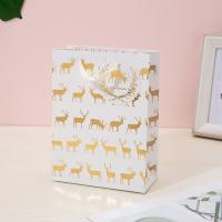 China Customized gold foiled logo paper gift shopping bag for sale
