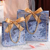 China wholesale luxury foldable shopping bag custom logo black paper gift bag with ribbon for sale