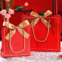 China wholesale luxury foldable shopping bag custom logo black paper gift bag with ribbon for sale
