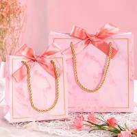 China wholesale luxury foldable shopping bag custom logo black paper gift bag with ribbon for sale