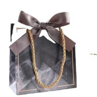 China wholesale luxury foldable shopping bag custom logo black paper gift bag with ribbon for sale