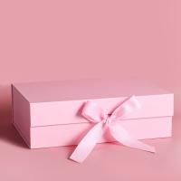 China Customized Elegant Magnetic Folding Cardboard Rigid Box Makeup Box With Ribbon for sale