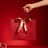 China Customized Printed Red Christmas Paper Bags with Ribbon Bow for sale