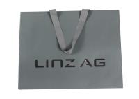 China Glossy Gift Bag With Handles , Hot Stamping Ribbon Handle Paper Bags for sale
