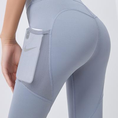 China 86cm High Waisted Yoga Pants with Pockets Seamless Scrunch Butt Leggings Women Tight for sale