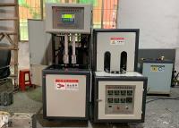 China 1L 1.5L Plastic PET Bottle Blowing Machine 2 Cavity Semi Automatic for sale