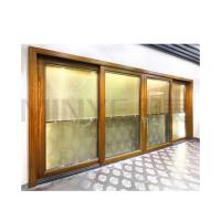 China Wood Grain Aluminium Sliding Doors Double Tempered Glass 5mm+12A+5mm Good Sealing for sale