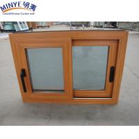 China Soundproof UPVC Sliding Windows Double Glazed 5+12A+5mm Wood Color ROTO Hardware for sale