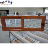 China Soundproof UPVC Sliding Windows Double Glazed 5+12A+5mm Wood Color ROTO Hardware for sale