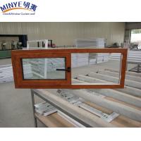 China Soundproof UPVC Sliding Windows Double Glazed 5+12A+5mm Wood Color ROTO Hardware for sale