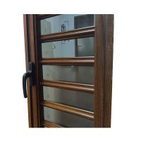 China Wood Grain Aluminum Glass Shutter Door Indoor ISO9001 CE 6063-T5 5mm Tempered Glass for sale