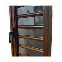 China Wood Grain Aluminum Glass Shutter Door Indoor ISO9001 CE 6063-T5 5mm Tempered Glass for sale