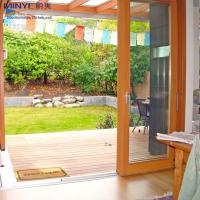 China Aluminum Hanging Wood Grain Glass Sliding Door with Prefabricated Frame 6063-T5 for sale