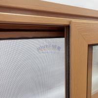 China Energy Efficient Aluminum Sliding Window with Wood Grain Finish and Stainless Steel Screen Netting 5mm+12A+5mm for sale
