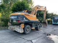 China Versatile Used DOOSAN 210w-9 Wheel Excavator 21 Ton DL06 Turbo Engine 1.34m³ Bucket Mobile Digging Machine for sale