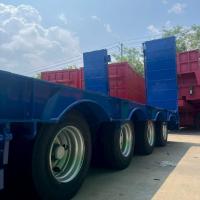 China Four Axle Lowbed Semi Trailer 60 Ton Heavy Equipment Transport Lowboy Platform Hauler for sale