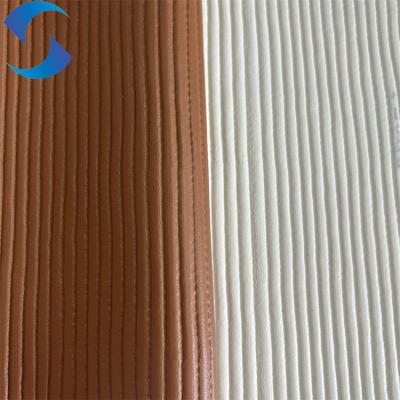China 100% Polyester Brushed Backing Technics China fabric Embossed Leather Fabric for leather bag for sale