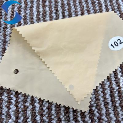 China 380T Nylon Taffeta Cire Fabric Glossy Calendered Nylon Ultra Light Fabric for Puffer Jacket for sale