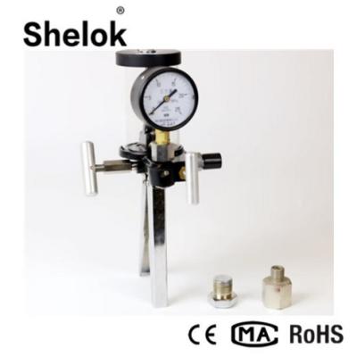 China Handheld 1/4NPT 0~1.6MPa air oil hand pump pressure calibrator for sale
