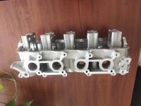 China Suzuki G16A G16B Cylinder Head 11110-57802 11100-71C01 11100-57B02 Iron Engine Part for sale