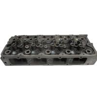China Kubota V2607T V2607DI Complete Cylinder Head 4 Cylinder Diesel Engine Part for sale