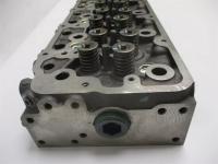 China Kubota V2607T V2607DI Complete Cylinder Head 4 Cylinder Diesel Engine Part for sale