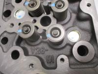 China Kubota V2607T V2607DI Complete Cylinder Head 4 Cylinder Diesel Engine Part for sale