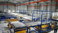 China Heavy-Duty PLC Controlled Stainless Steel Pallet Conveyor System for Automated Pallet Handling for sale
