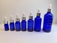 China Premium Customizable Glass Essential Oil Bottles | 5ml-100ml Dropper Bottles with Multi-Material Caps & Scale Options for sale