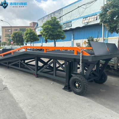 China 10-12 Ton Hydraulic Manual Container Loading Ramp Mobile Forklift Ramps Dock Leveler Ramp for sale
