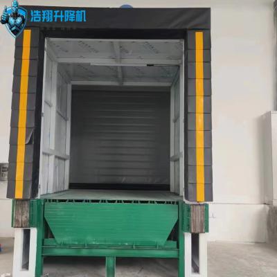 China Green 10T Warehouse Fixed Hydraulic Dock Leveler Hydraulic Dock Ramp Adjustable Height Loading Dock for sale