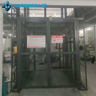 China Customized 500kg-20000kg Hydraulic Elevator Large Capacity 6M High Four-fold Door For Freight Transport for sale