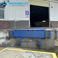 China Hydraulic Dock Ramp Gray - Adjustable Height 5T-18T - No Pit Needed for Warehouse Truck Container Handling for sale