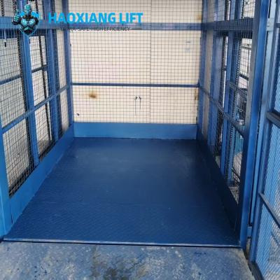 China 6m High 7-Ton Blue Hydraulic Freight Elevator – Customized for Industrial Indoor Operations for sale