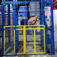China Custom 2-Ton 6M Industrial Indoor Hydraulic-Driven Cargo Lift with Four-section Door & Rhombic Mesh Barrier for sale