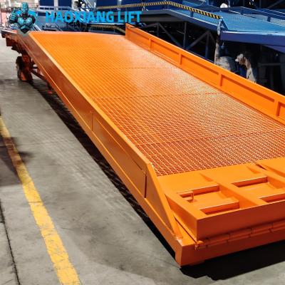 China 10T Heavy Duty Hydraulic Mobile Dock Ramp - Orange Customizable Hollow Steel Grid Plate, Forklift-Compatible Anti-Slip Diamond Surface for sale