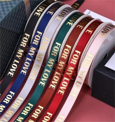 China Customize Polyester Foil Gold Printed Satin Ribbon For Gift Packing Box 9MM for sale