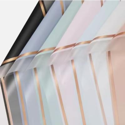 China Korean Flower Wrapping Paper Plastic Packing Paper with Golden Line Frame Many Colors for sale