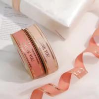 China Customized Polyester Gold Foil Branded Ribbon with 3D Logo for Christmas and Birthday for sale