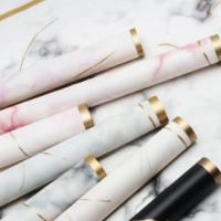 China Gold Edge Marble Flower Wrapping Paper Border Plastic Opp Film Wrapping Paper Wholesale for sale