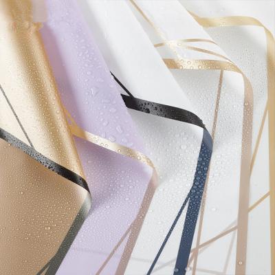 China Gold-Trimmed Corner Korean Style Waterproof Floral Wrapping Paper Matte Bouquet Wrap for Flower Shop for sale
