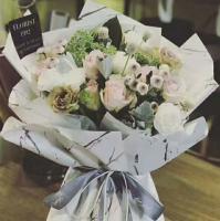 China The manufacturer wholesales Valentine's Day white marble-patterned flower bouquets, wrapping paper gifts, and DIY packaging gifts for flower shops for sale