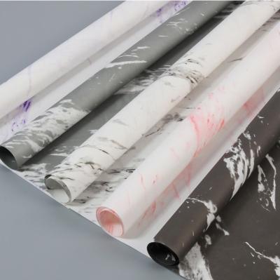 China The manufacturer wholesales Valentine's Day white marble-patterned flower bouquets, wrapping paper gifts, and DIY packaging gifts for flower shops for sale