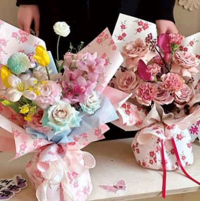 China Spring floral packaging paper, thickened fresh flower bouquet packaging paper, waterproof printed packaging paper, flower shop floral art packaging for sale