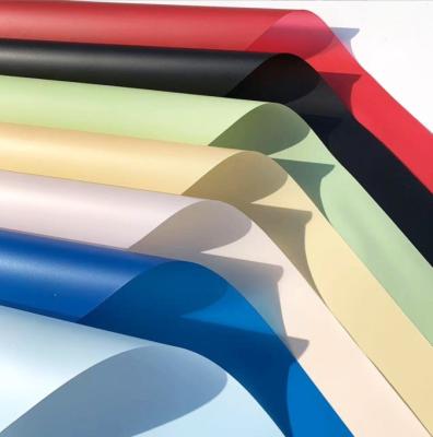 China Solid-color matte paper-wrapped flower paper, flower packaging paper material, flower shop bouquet waterproof packaging paper, semi-transparent plastic paper for sale