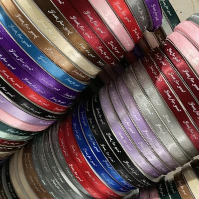 China Spot flower packaging, ribbon, silk tape, polyester tape, printed English gift box packaging, bouquet wrapping material, tape for sale