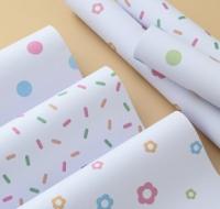 China Thickened cowhide, playful and colorful flower packaging paper for sale
