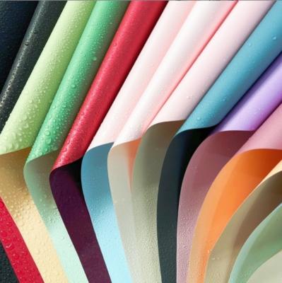 China Thickened flower wrapping paper, double-color, double-sided Ouya paper wholesale, solid-color flower wrapping paper, flower art, Qixi Festival bouquet wrapping paper for sale