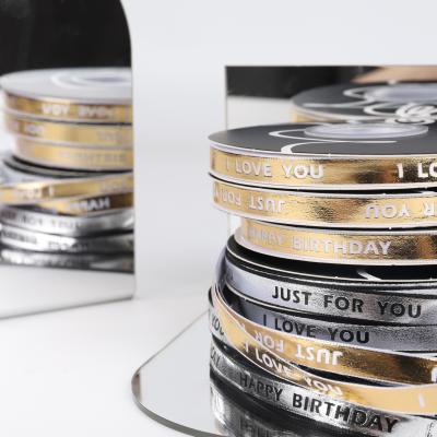 China 1cm hot stamping English letter small gold bar floral tie gift cake ribbon DIY material gift box decorative tape for sale