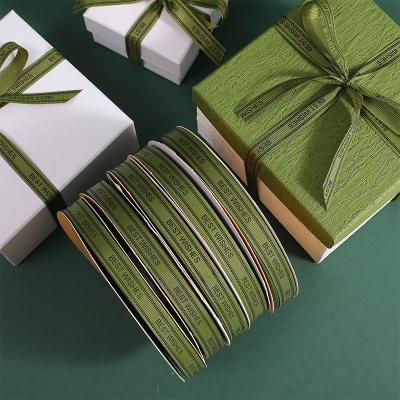 China Military green gift packaging ribbon letter ribbon gift box ribbon flower baking strap 1.5cm ribbon wholesale for sale